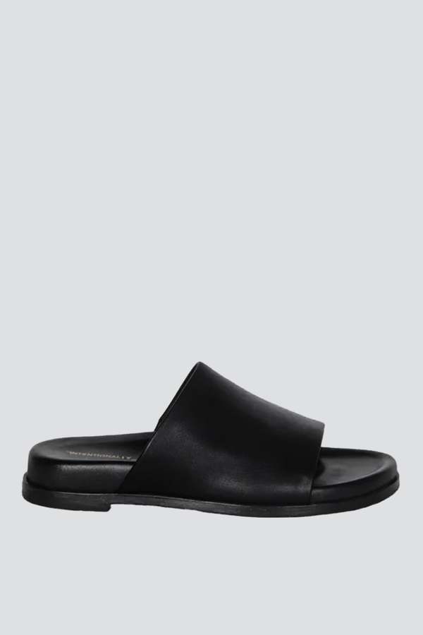 "INTENTIONALLY __________." Black Pippy Slip On Sandal - Black | Garmentory