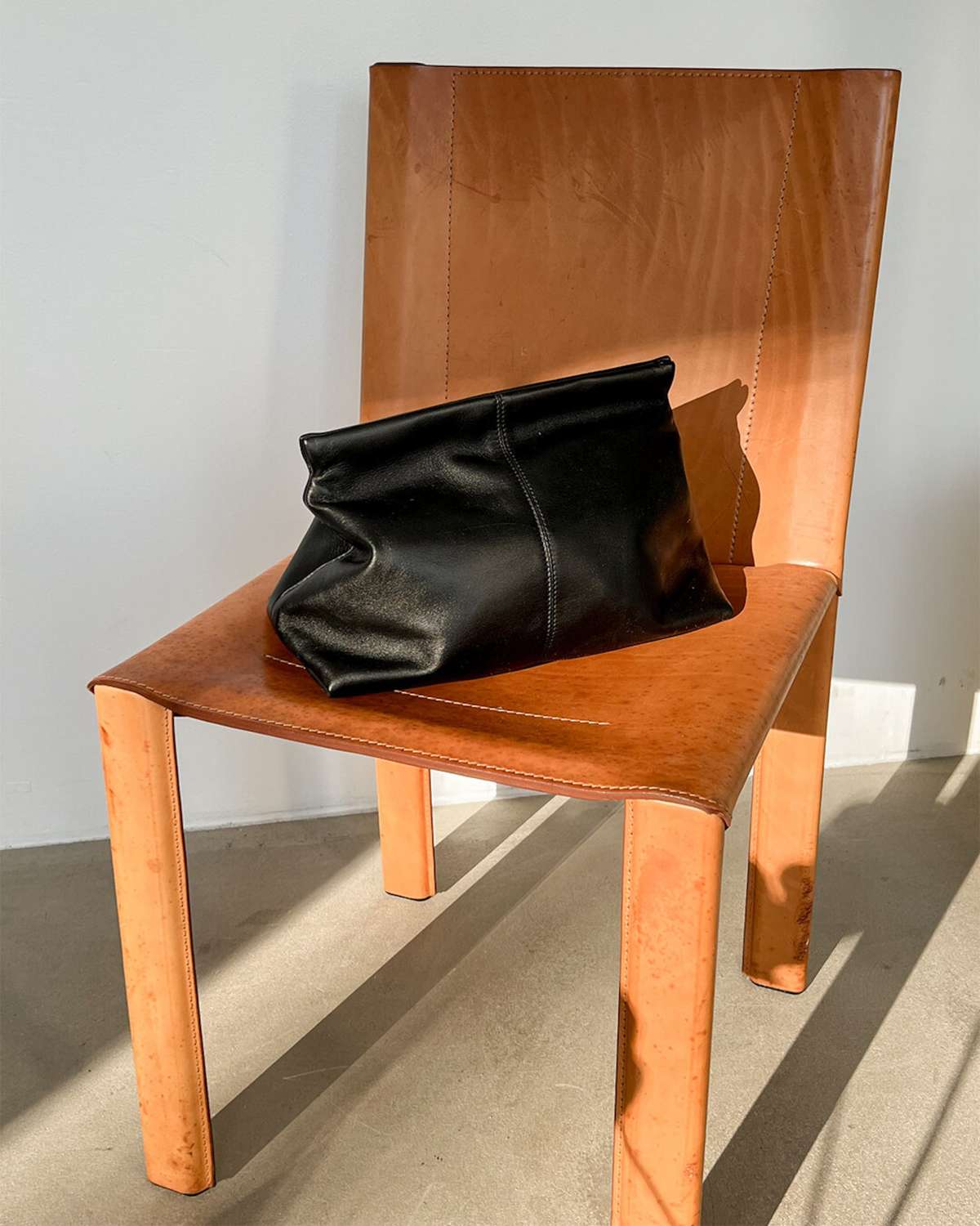 Flattered Clay Leather Clutch Bag - Black | Garmentory