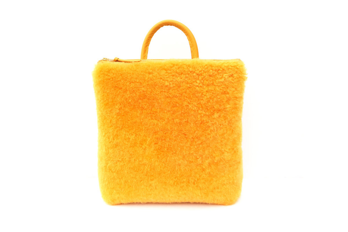 Primecut CHEETO ORANGE SHEARLING BACKPACK | Garmentory