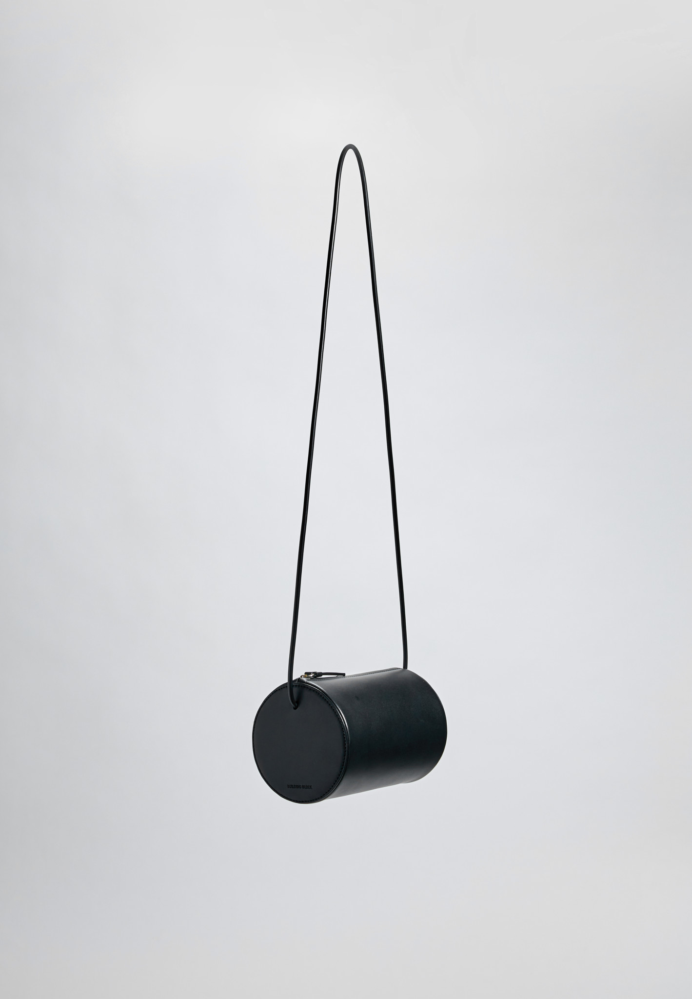 Building Block Cylinder Sling - Black Leather | Garmentory