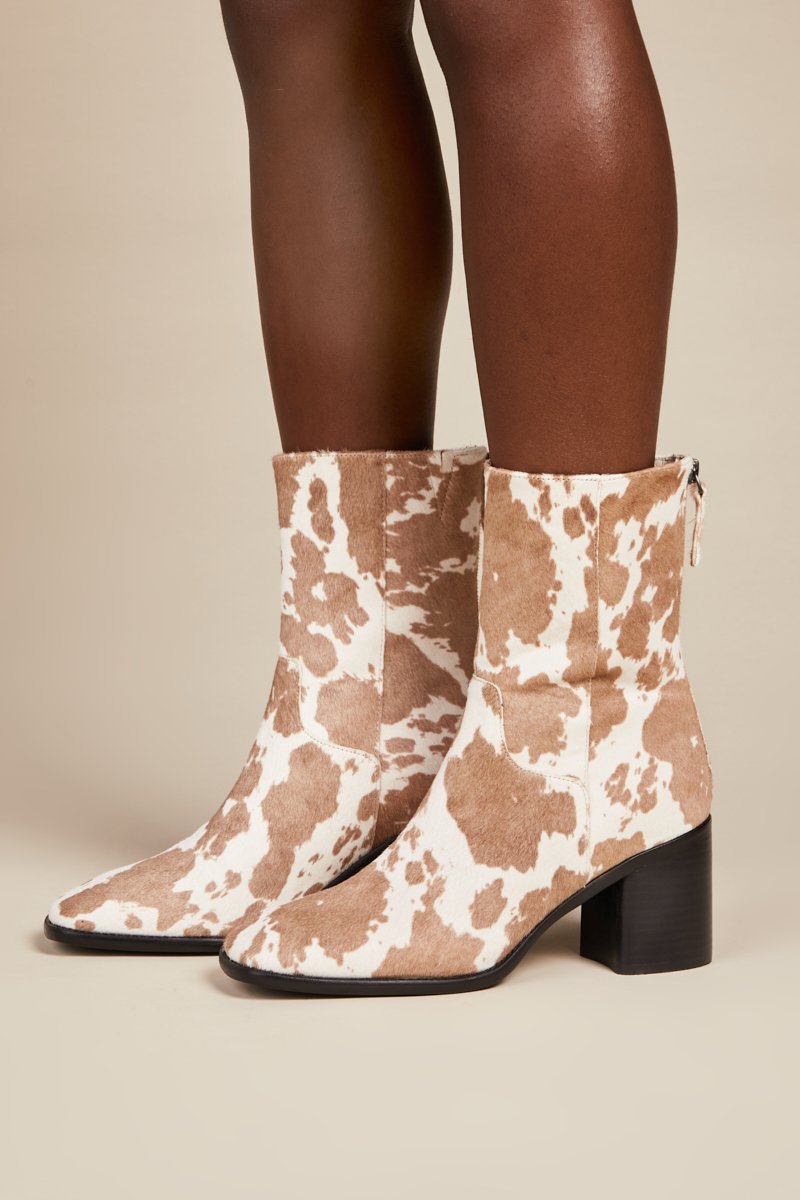 "INTENTIONALLY __________." PG Boots - Moo Taupe | Garmentory