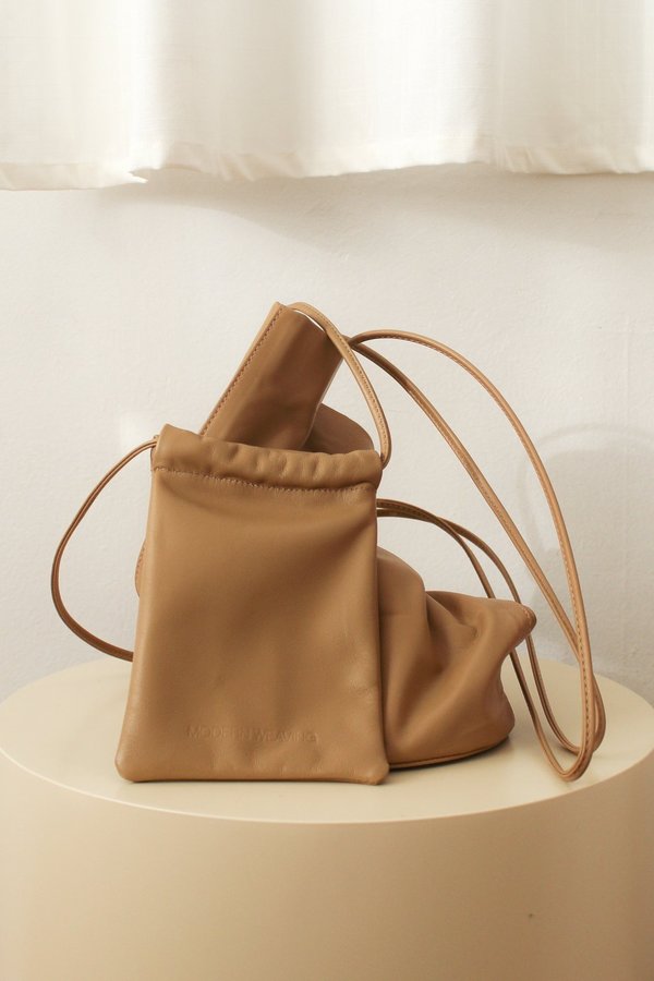 Modern Weaving Drawstring Sling Bag - Camel | Garmentory