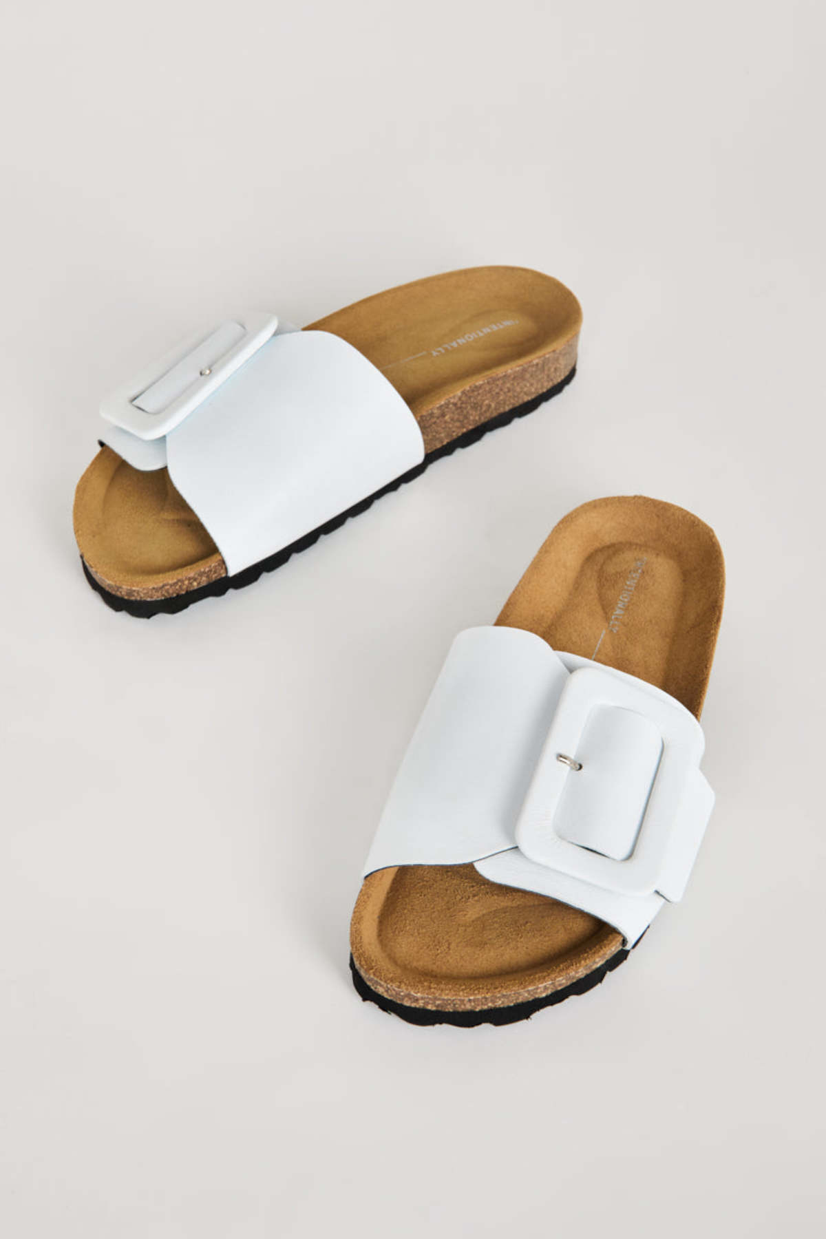 "INTENTIONALLY __________." Clarice Sandal - White | Garmentory