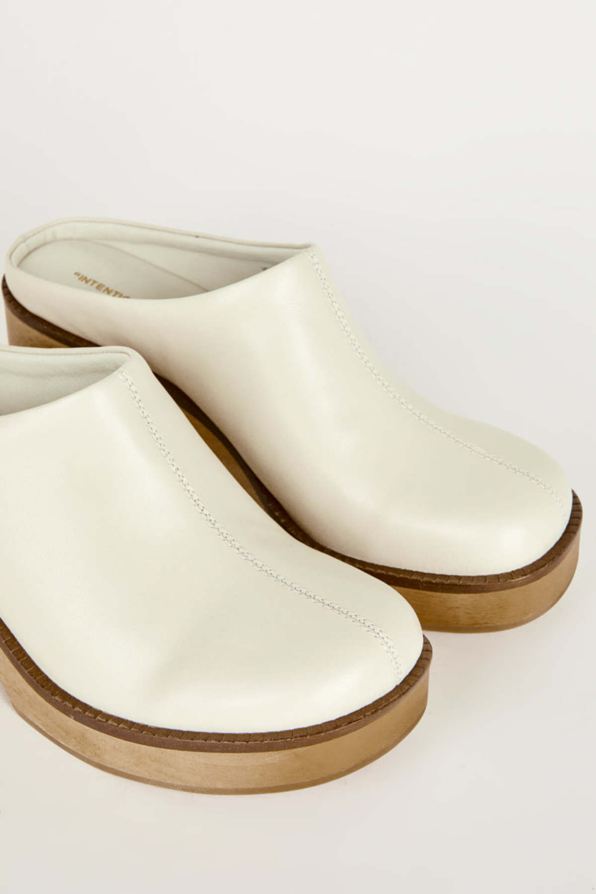 "INTENTIONALLY __________." Tides Clog Mule - Cream | Garmentory