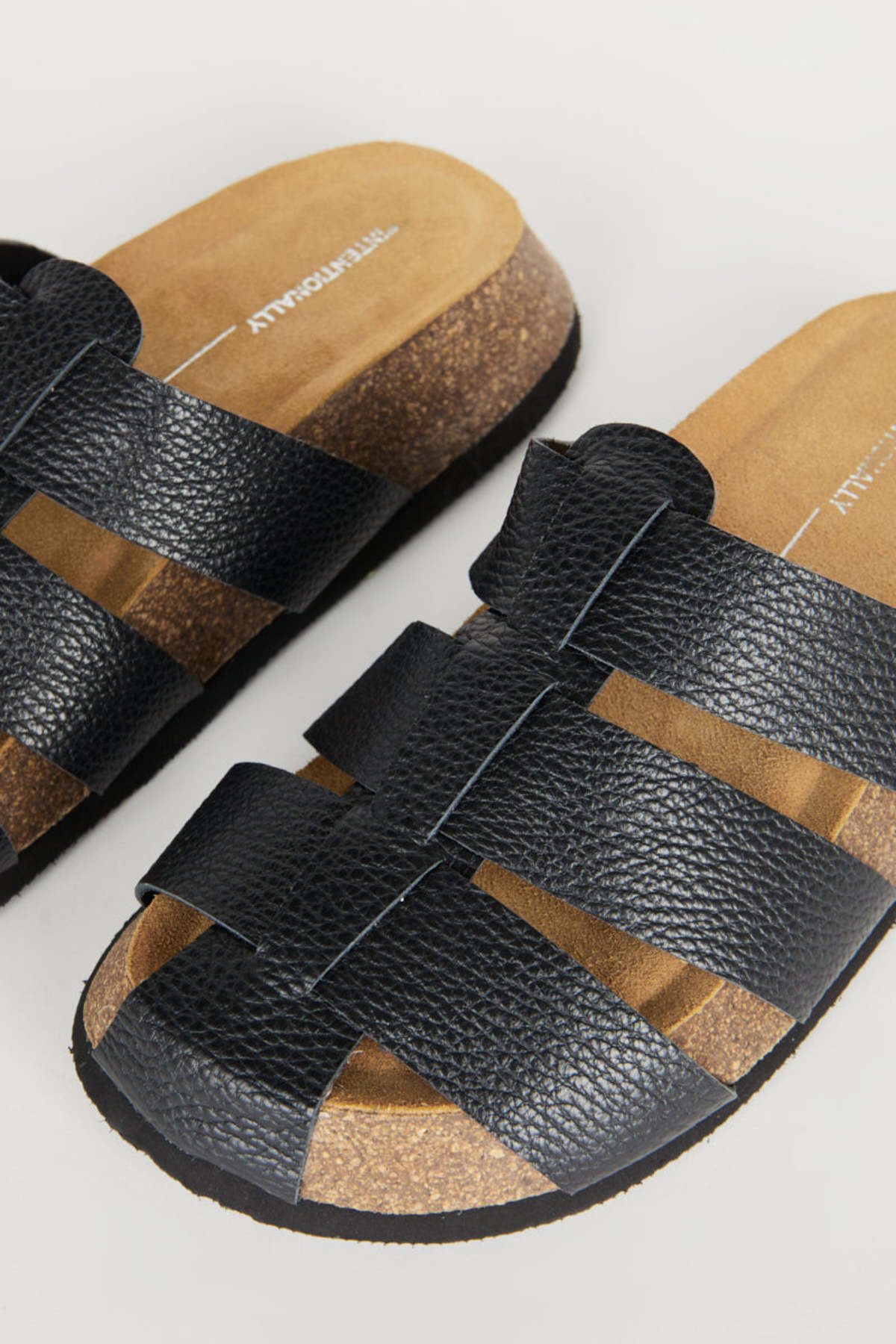"INTENTIONALLY __________." Raft Fisherman Sandal - Black | Garmentory