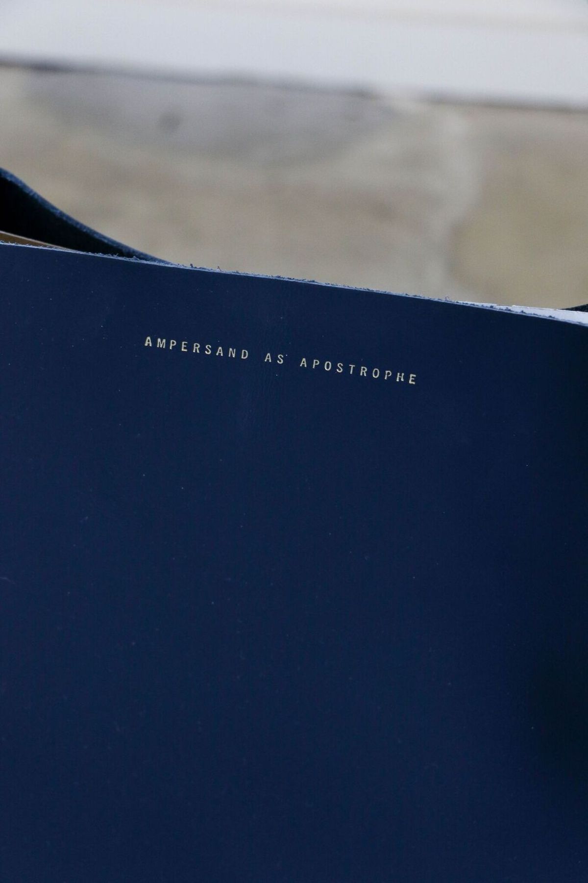 Ampersand as Apostrophe Stiff Sideways Tote in Matte Navy | Garmentory