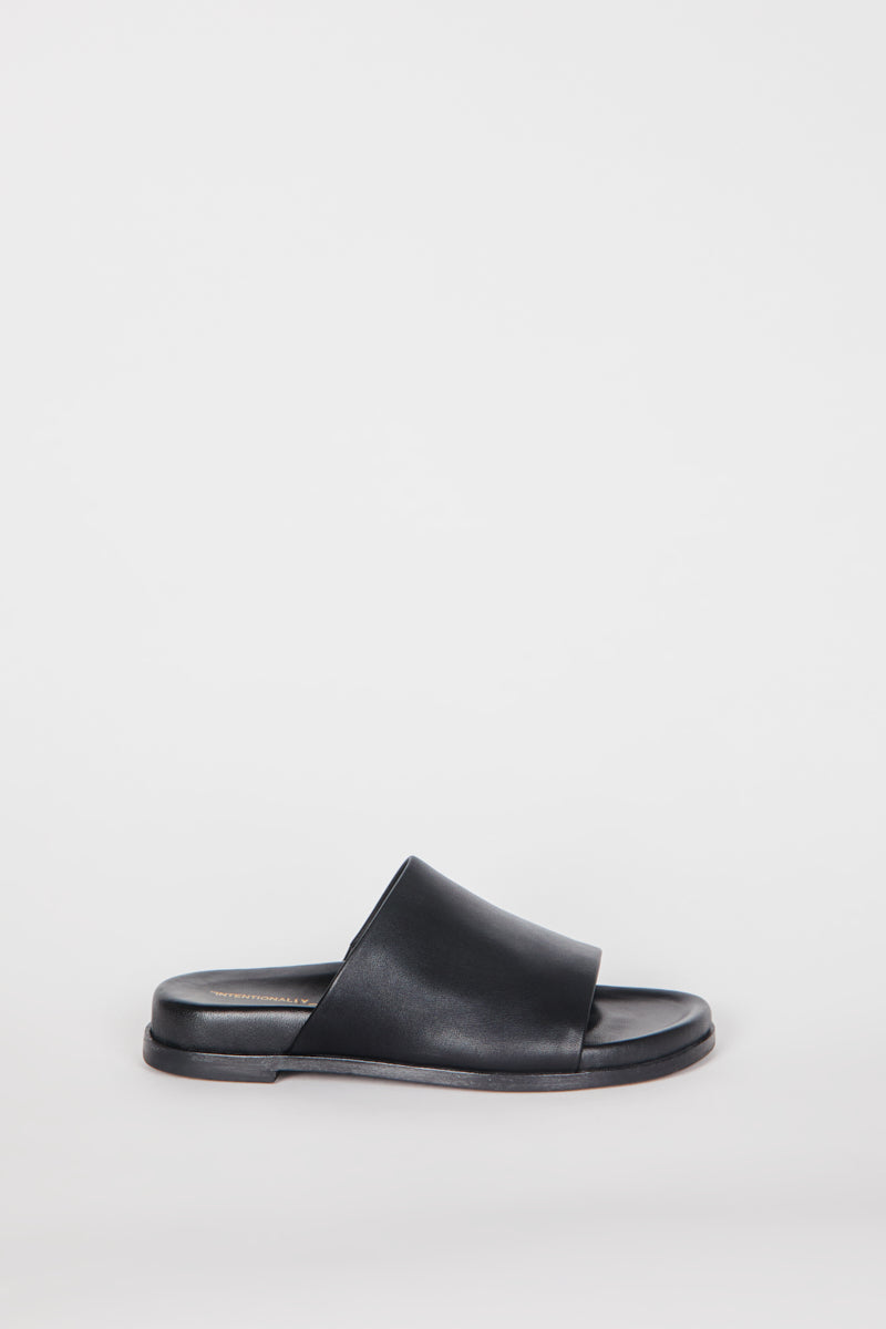 "INTENTIONALLY __________." Pippy Slip On Sandal - Black | Garmentory