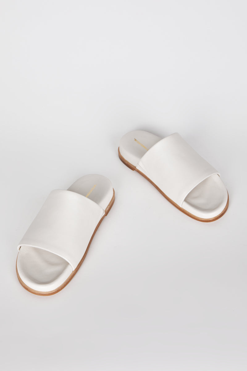 "INTENTIONALLY __________." Pippy Slip On Sandal - Black | Garmentory