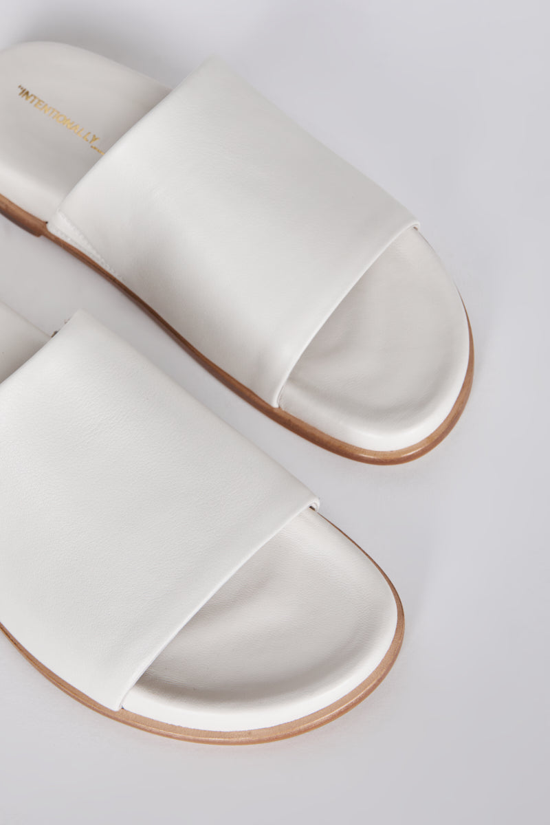 "INTENTIONALLY __________." Pippy Slip On Sandal - Black | Garmentory