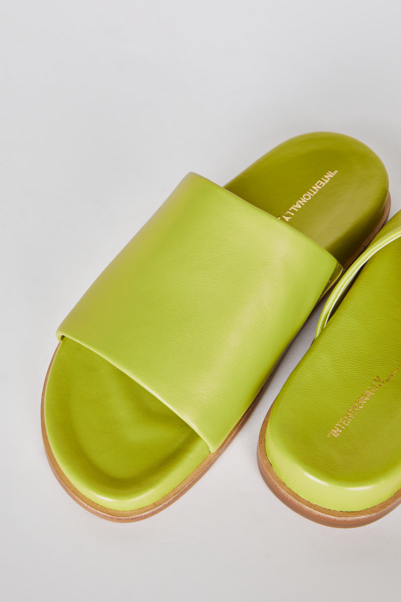"INTENTIONALLY __________." Pippy Slip On Sandal - Black | Garmentory