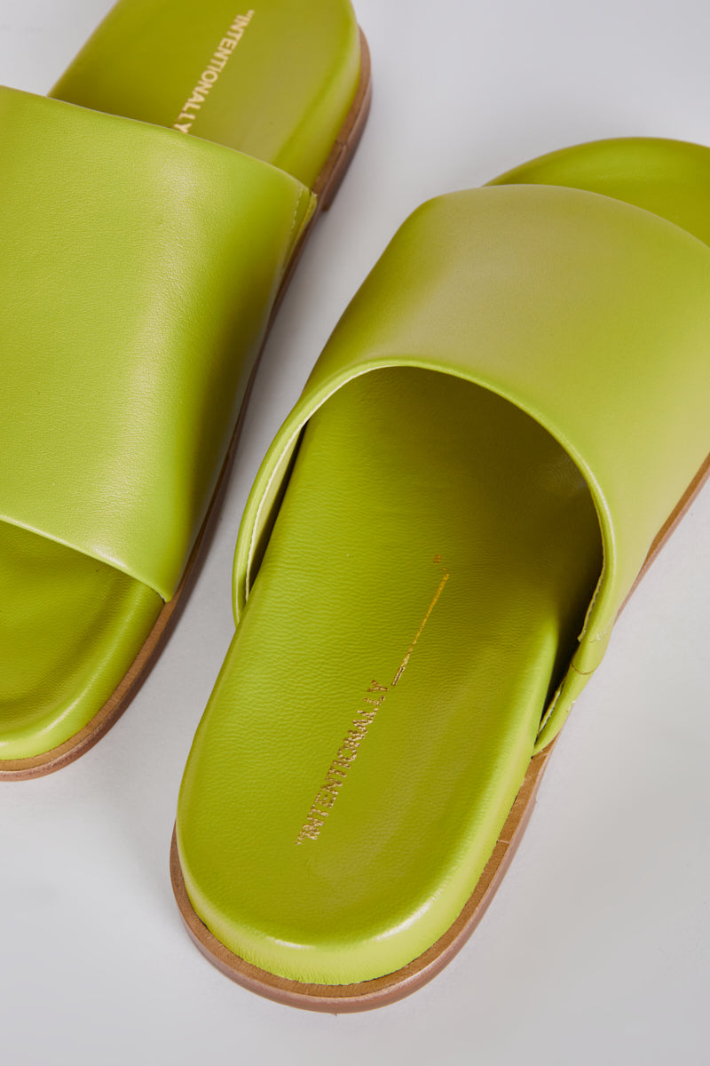 "INTENTIONALLY __________." Pippy Slip On Sandal - Black | Garmentory