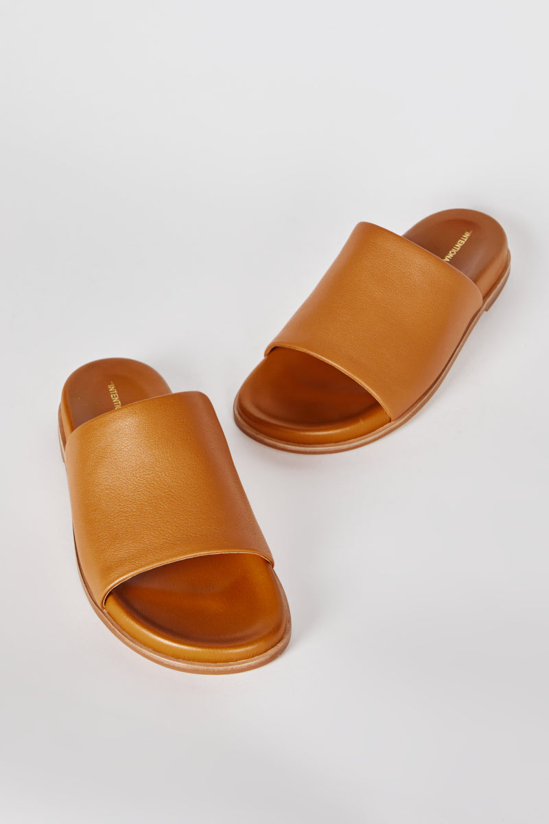 "INTENTIONALLY __________." Pippy Slip On Sandal - Black | Garmentory