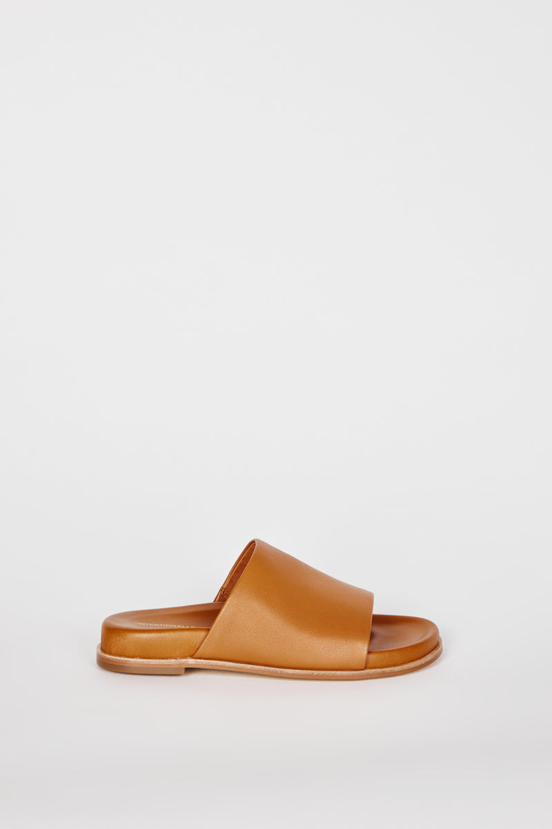 "INTENTIONALLY __________." Pippy Slip On Sandal - Black | Garmentory