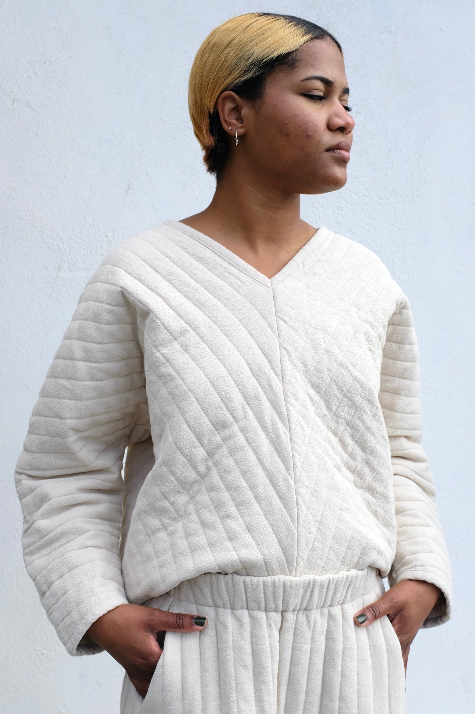 Black Crane Quilted V Neck Top - Ivory | Garmentory