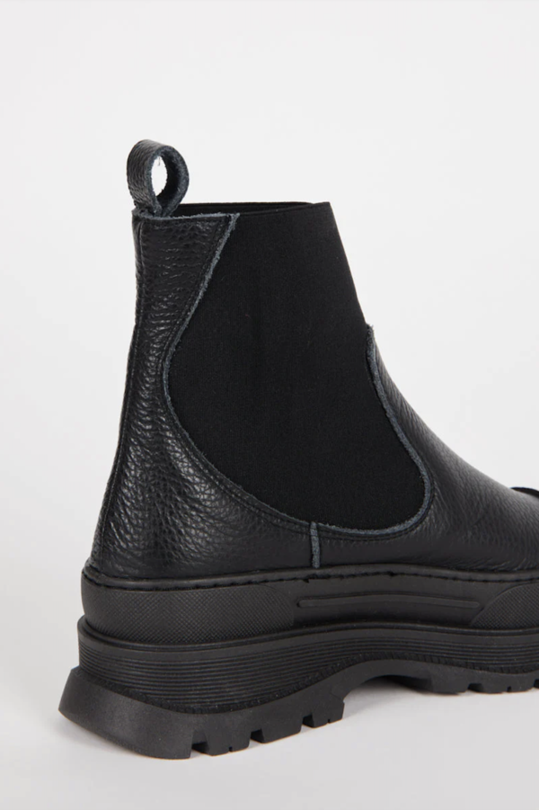 "INTENTIONALLY __________." Blank Court Lug Sole Boot - Black | Garmentory